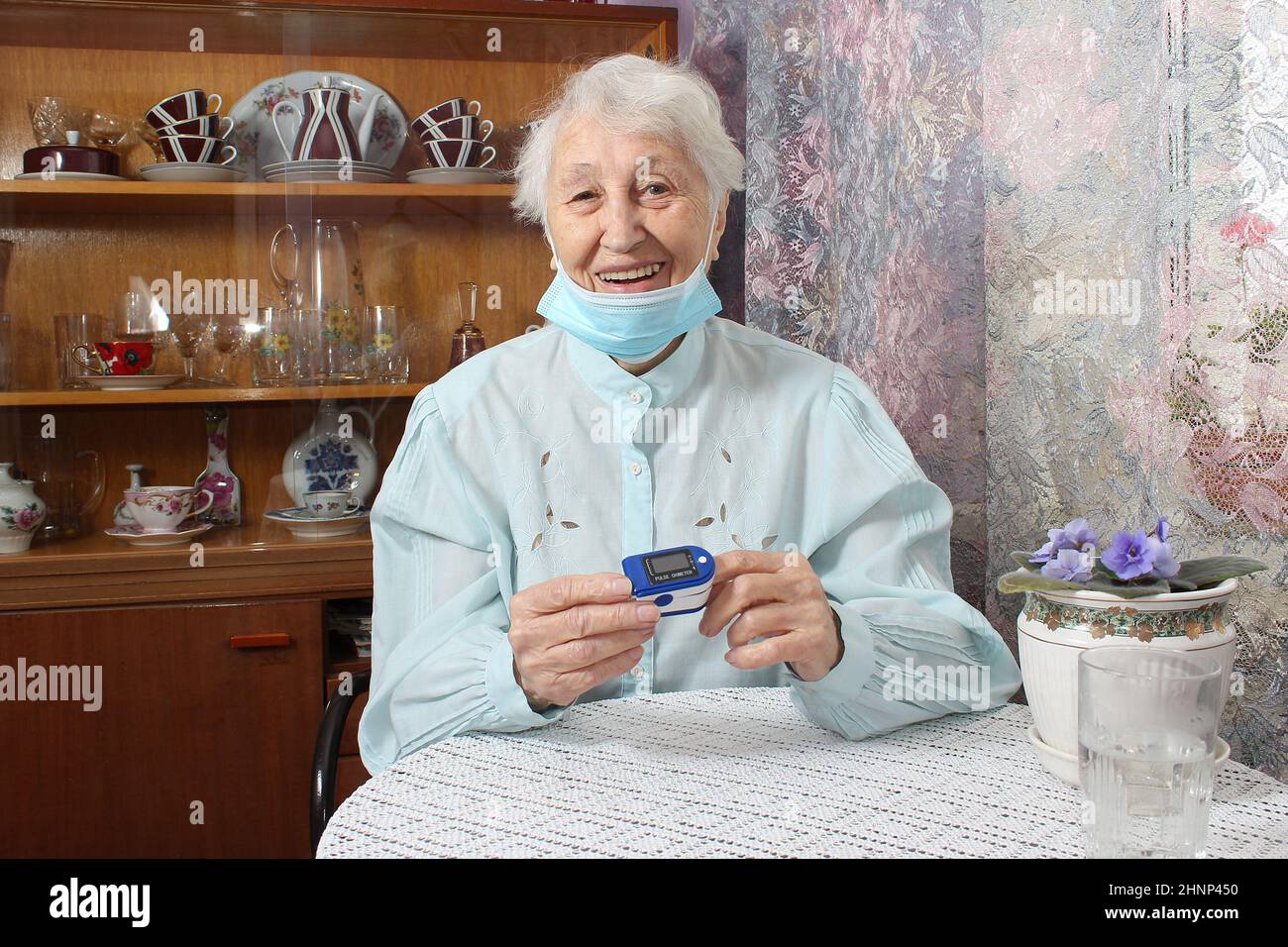 Using Pulse Oximeter at Home to Test Oxygen Level in Blood Stock Photo ...