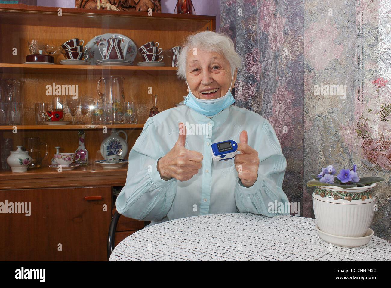 Using Pulse Oximeter at Home to Test Oxygen Level in Blood Stock Photo ...