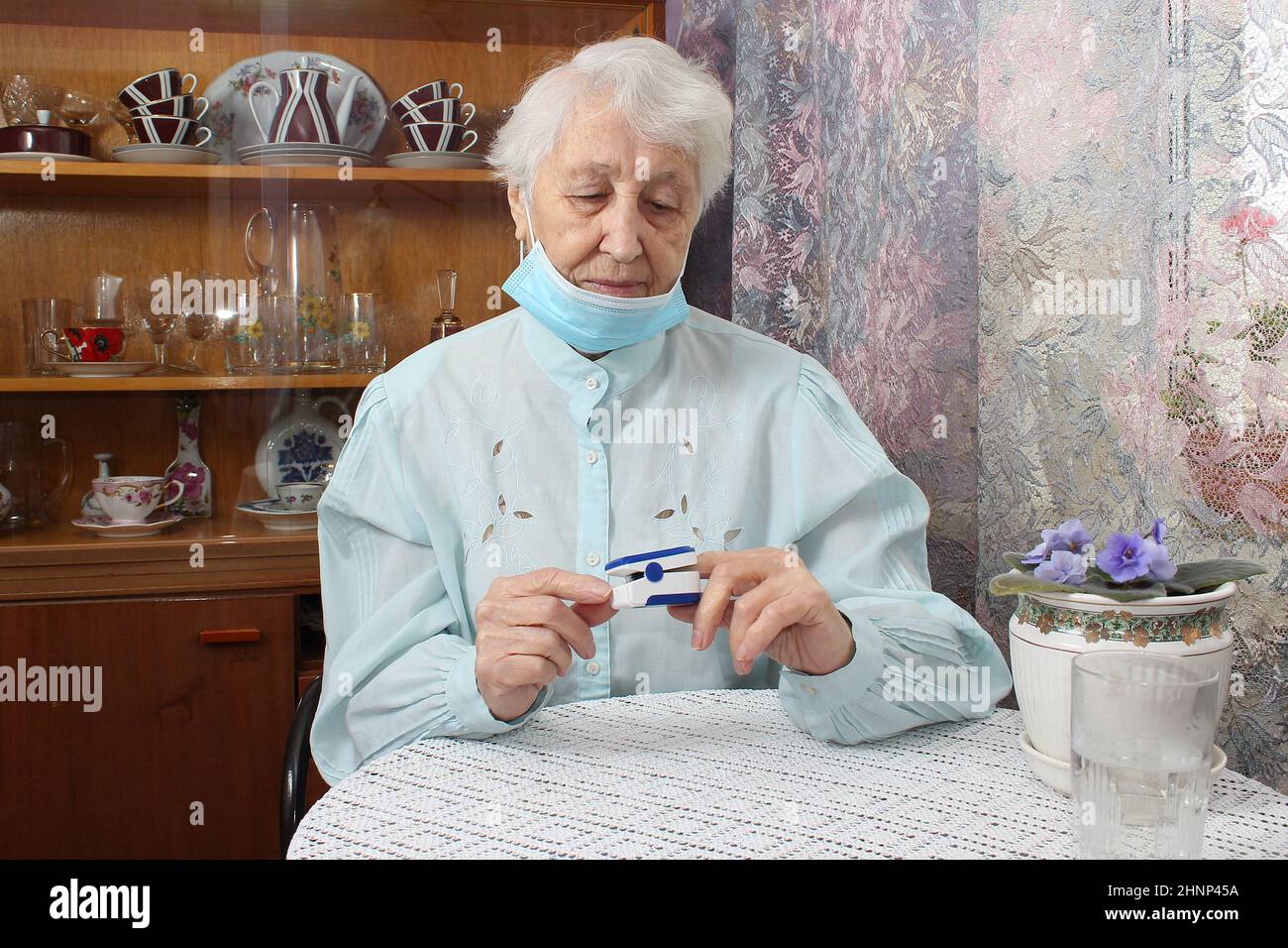 Using Pulse Oximeter at Home to Test Oxygen Level in Blood Stock Photo ...