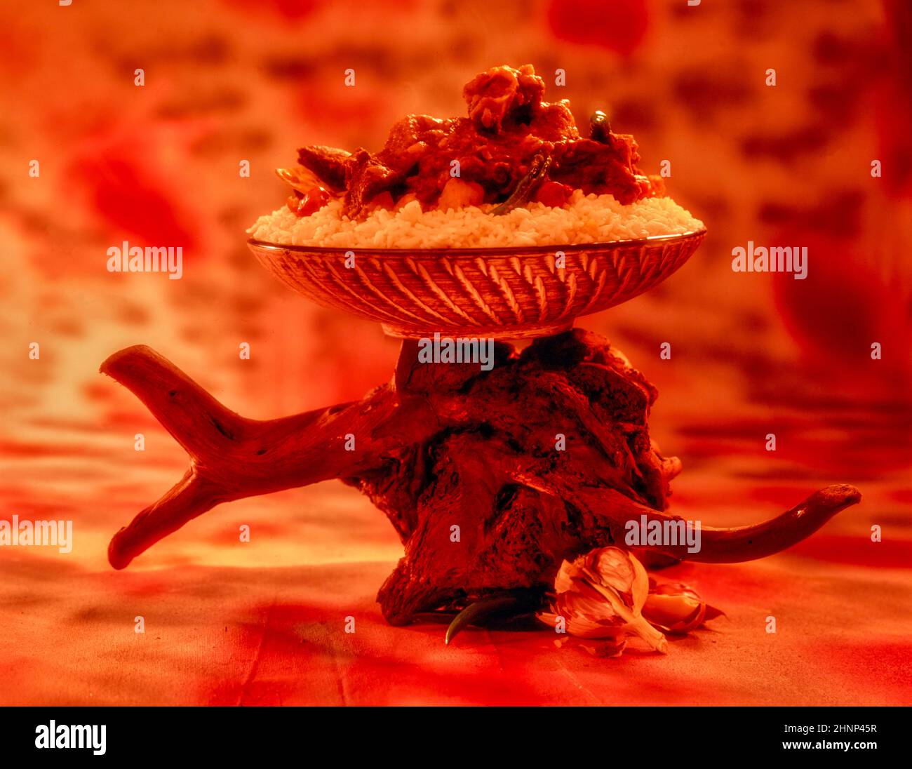Food still-life of Curry Goat and white rice on a driftwood base Stock ...