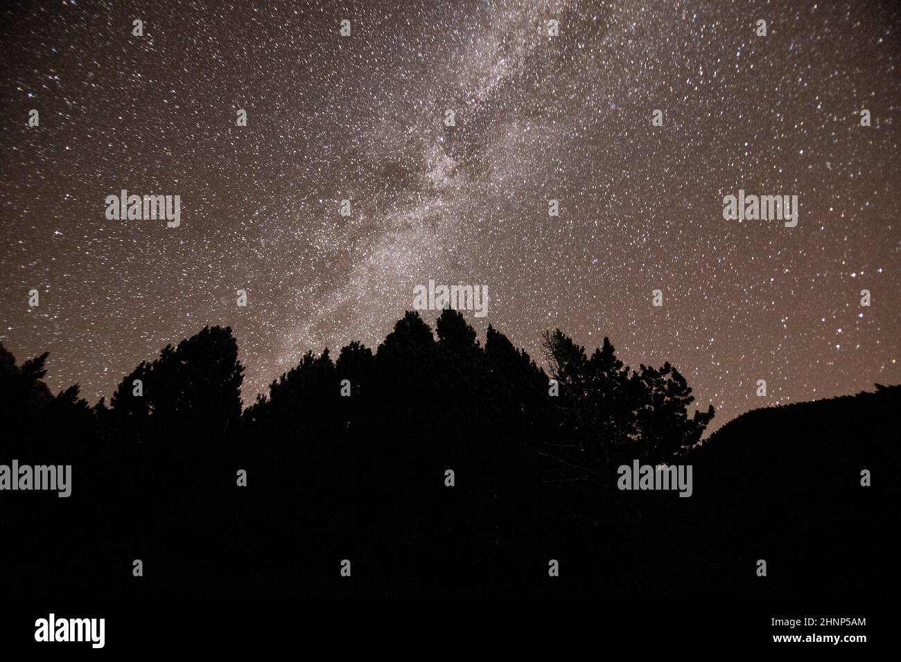 Milky way and stars at night in a mountain in Pyrenees in Catalonia ...