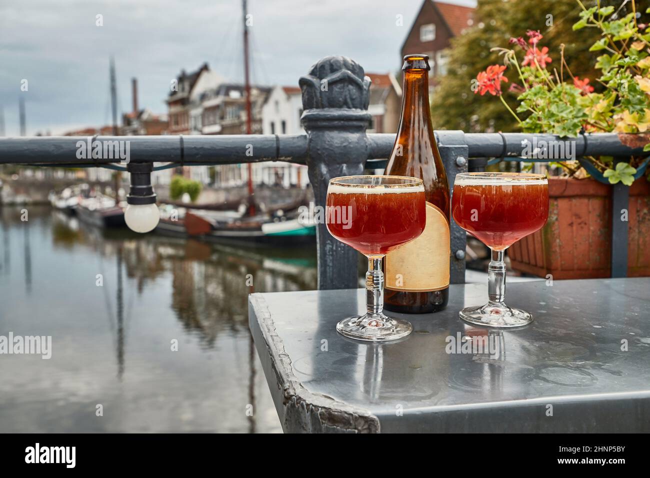 Beer in glasses on an outdoor terrace, pleasant view over the canals in ...