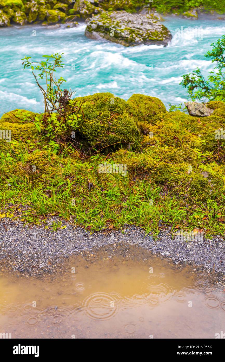 Dirty puddle water and turquoise river Utla in Utladalen Øvre Årdal ...