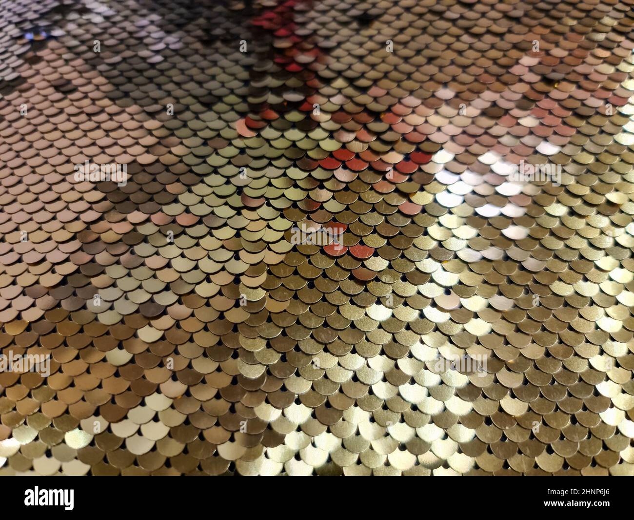 Close up view on samples of sequin fabric in golden colors Stock Photo ...
