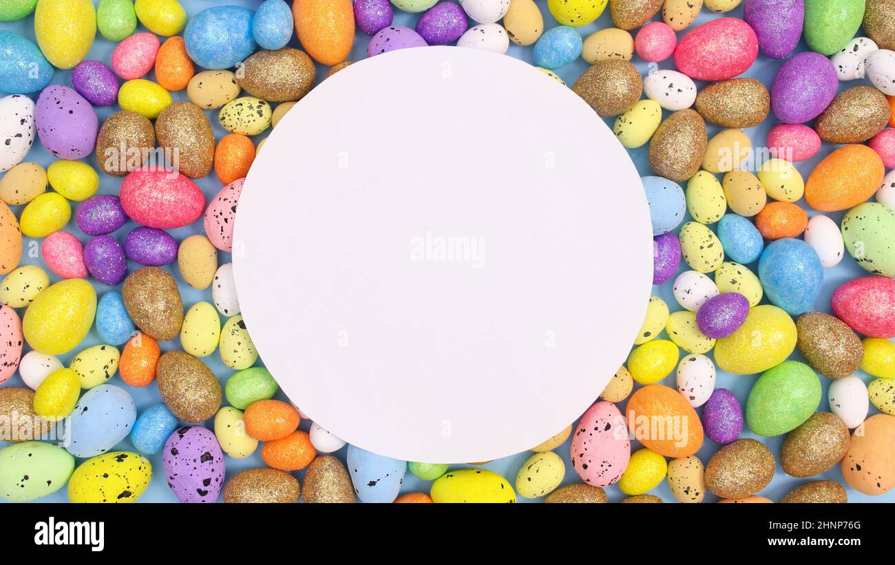 Easter paper card note with colorful creative eggs background. Flat lay ...