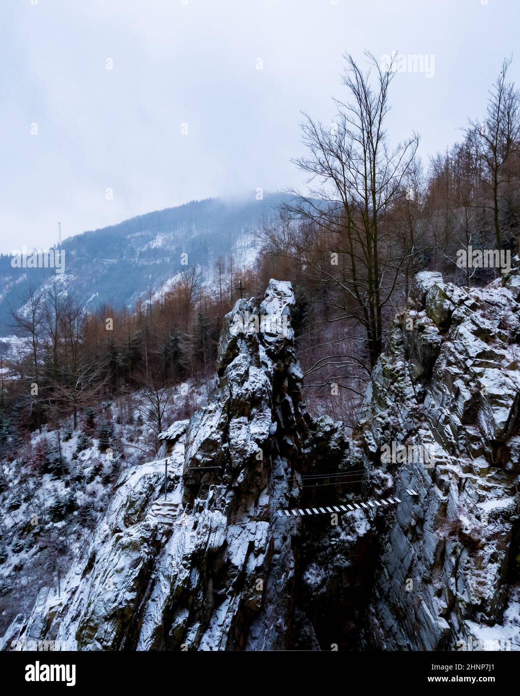 Bridge between huge rocks in winter Stock Photo - Alamy