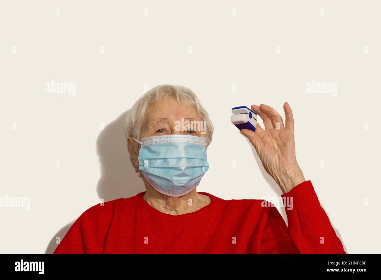 Using Pulse Oximeter at Home to Test Oxygen Level in Blood Stock Photo ...