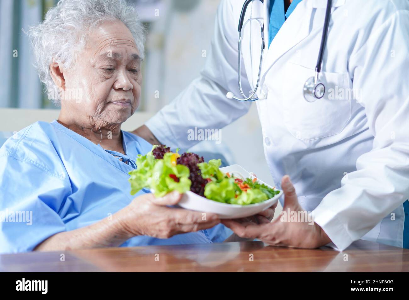 Asian Senior Or Elderly Old Lady Woman Patient Eating Breakfast