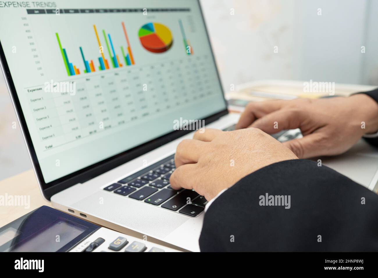 Asian accountant type keyboard to enter information, working, calculate ...