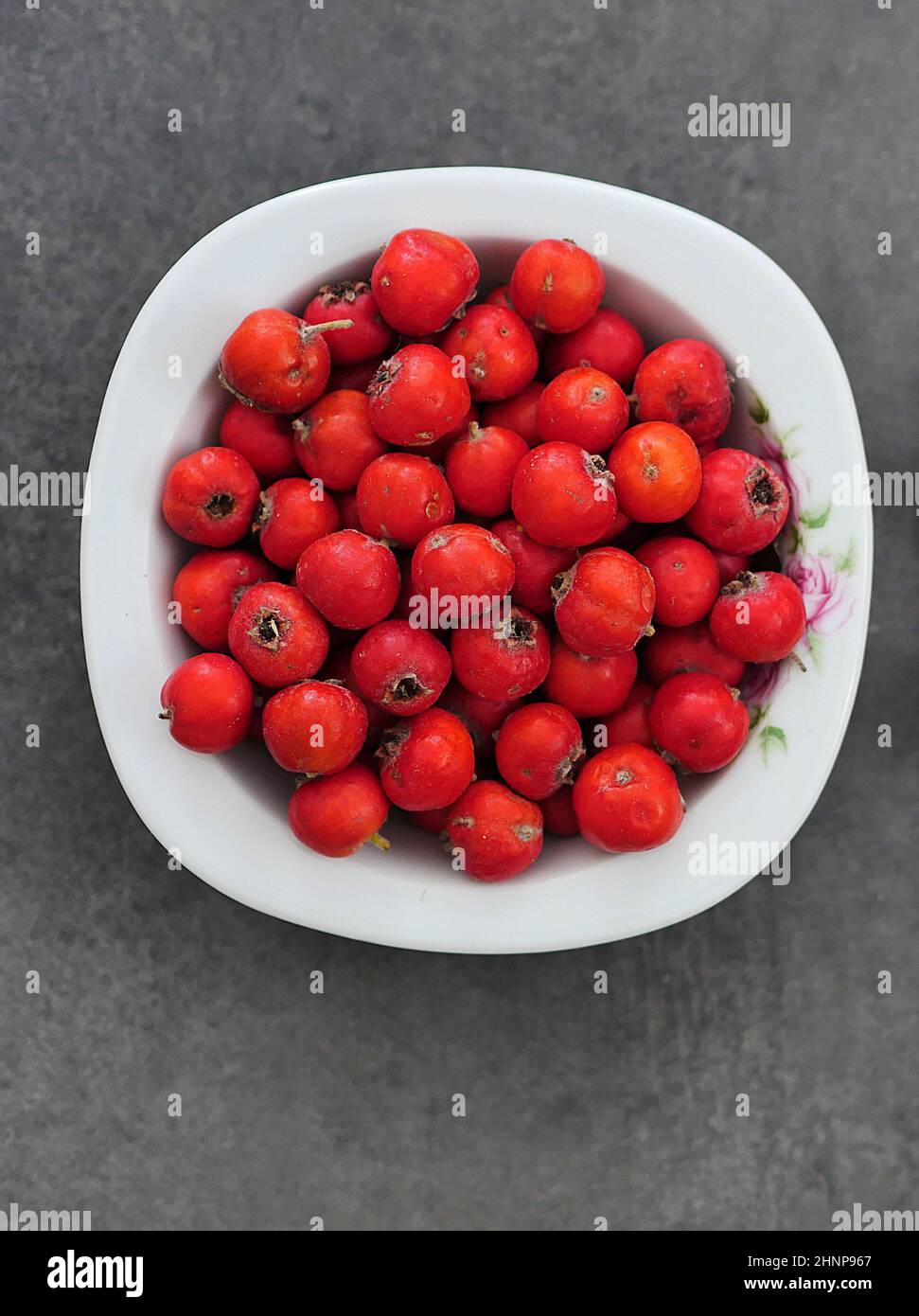 hawthorn in the plate, hawthorn fruit and its benefits Stock Photo - Alamy