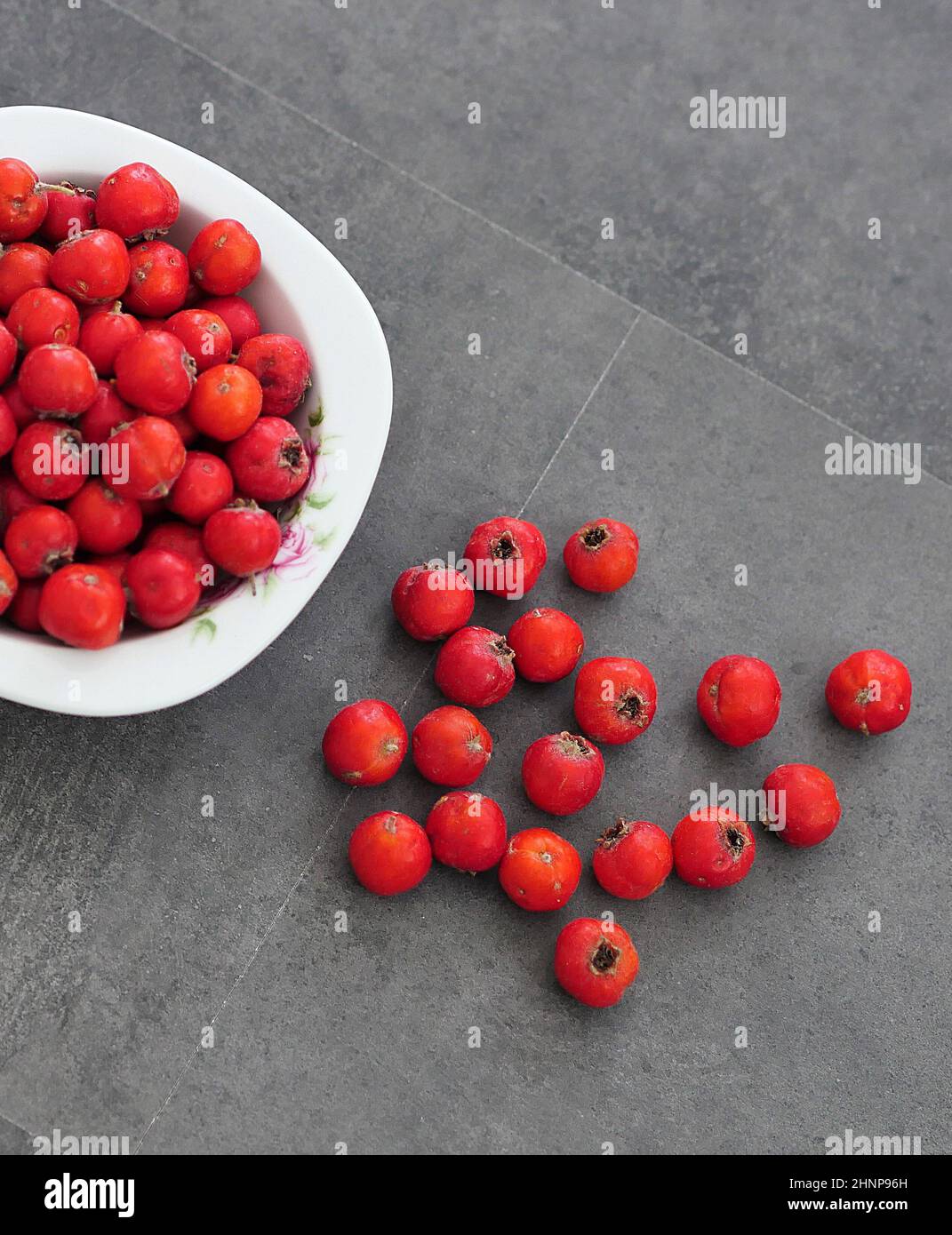 hawthorn in the plate, hawthorn fruit and its benefits Stock Photo - Alamy