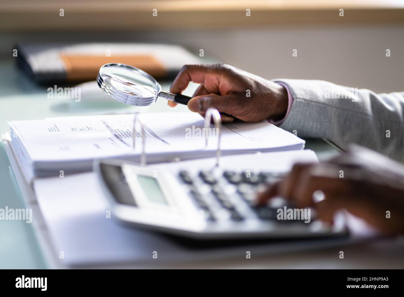 Auditor Using Magnifying Glass For Audit And Fraud Investigation Stock ...