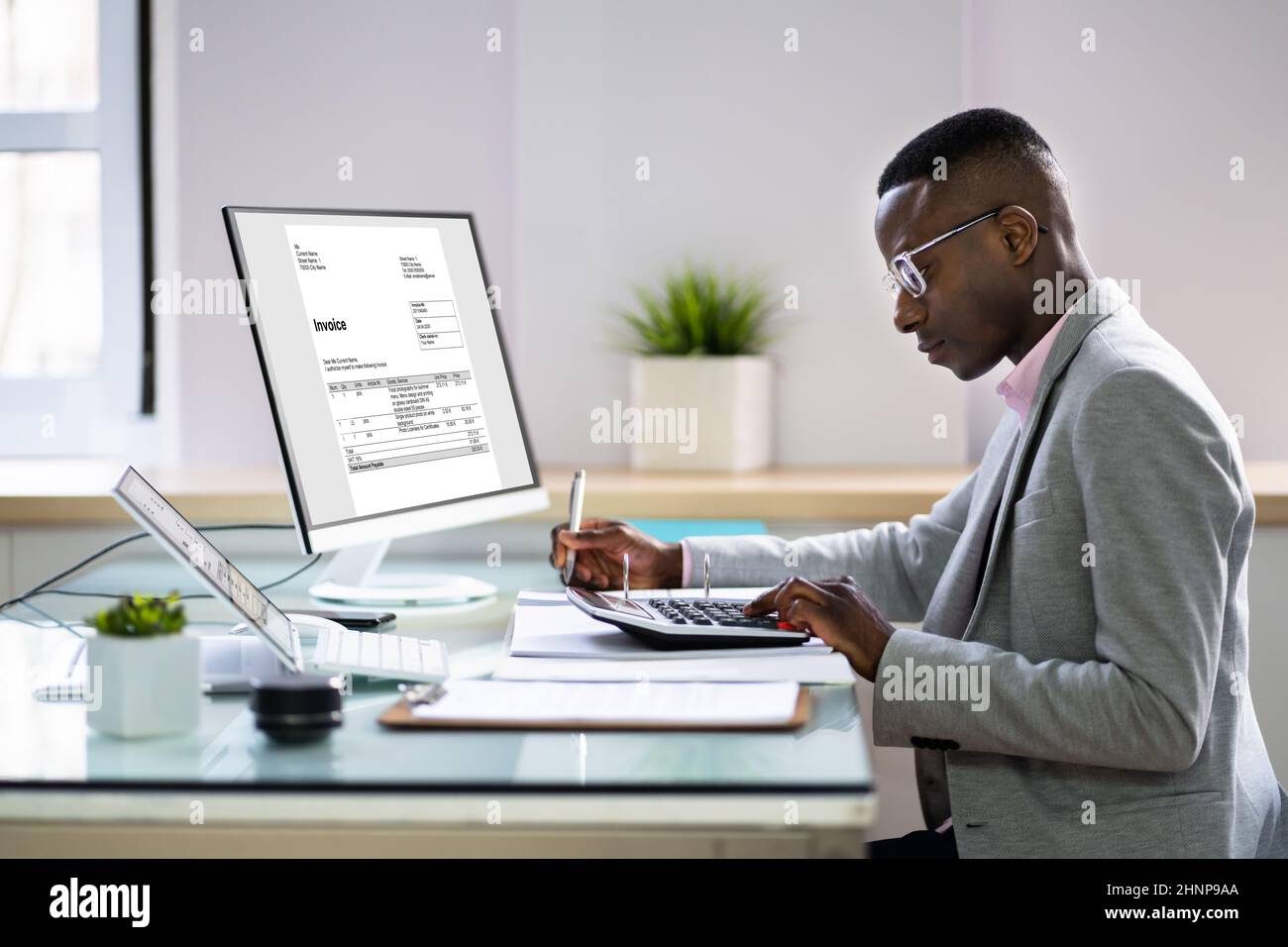 African American Tax Professional Male With E Invoice Stock Photo - Alamy