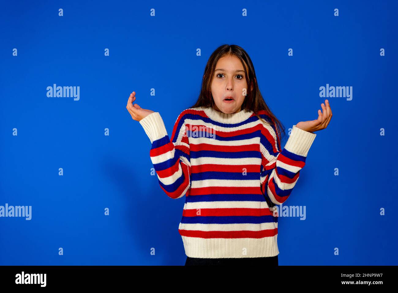 Photo of impressed positive pupil hands palms up open mouth shout ...