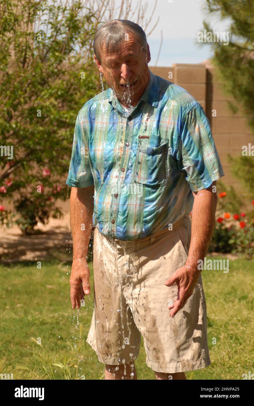 Man and water splash hi-res stock photography and images - Alamy