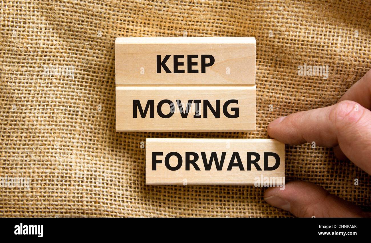 Keep moving forward symbol. Concept words Keep moving forward on blocks on beautiful canvas ...