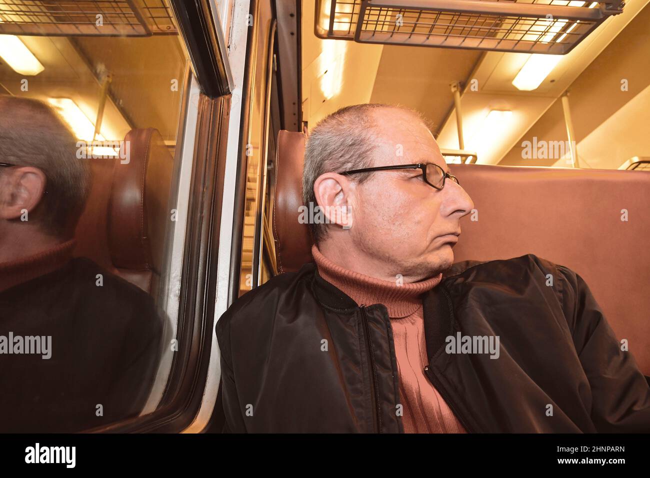 Elderly looking out train window hi-res stock photography and images ...