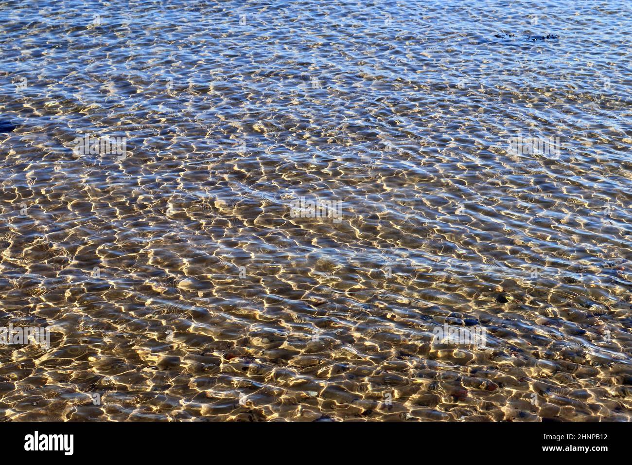 Detailed close up view on water surfaces with waves and ripples and the ...