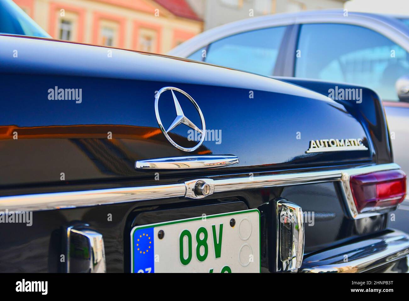 Mercedes Benz logo on a black vintage car. Close-up. Mercedes-Benz is a German automobile ...