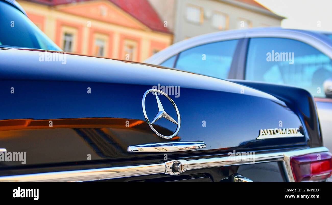 Mercedes Benz logo on a black vintage car. Close-up. Mercedes-Benz is a German automobile ...