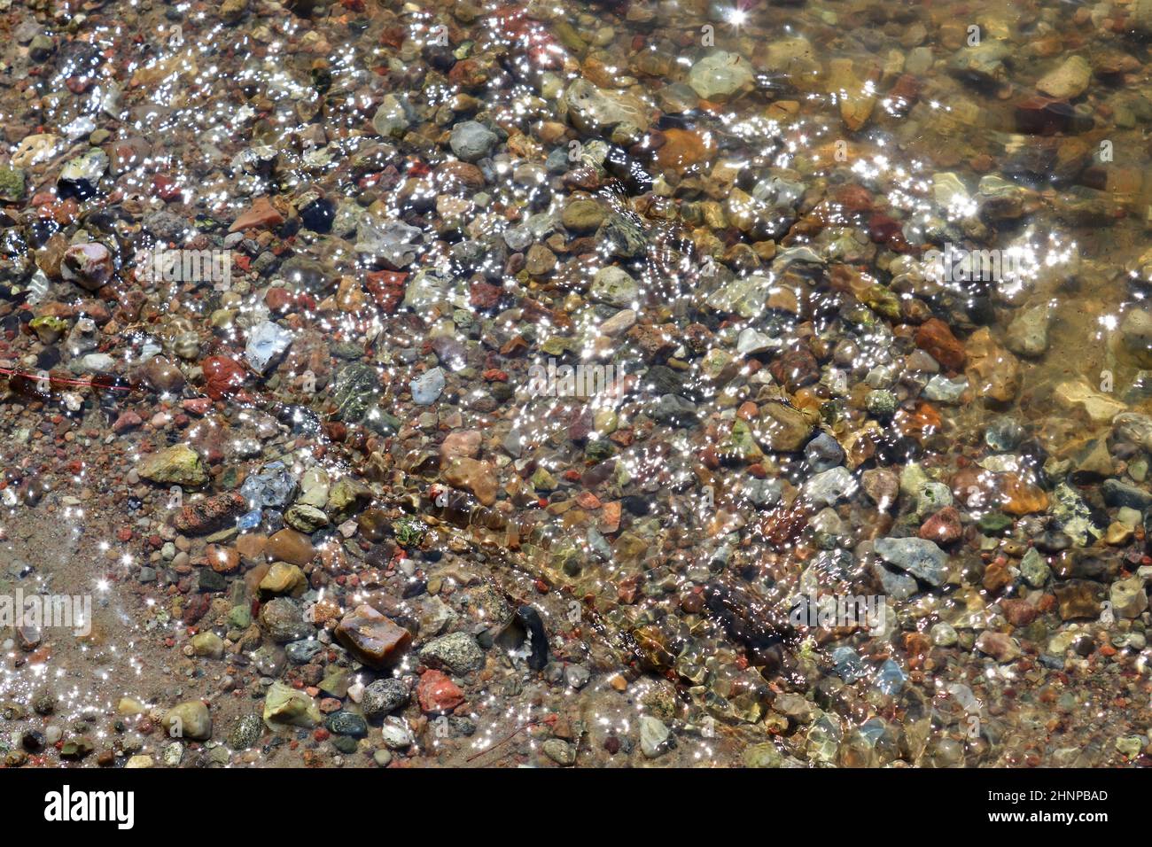 Detailed close up view on water surfaces with waves and ripples and the ...