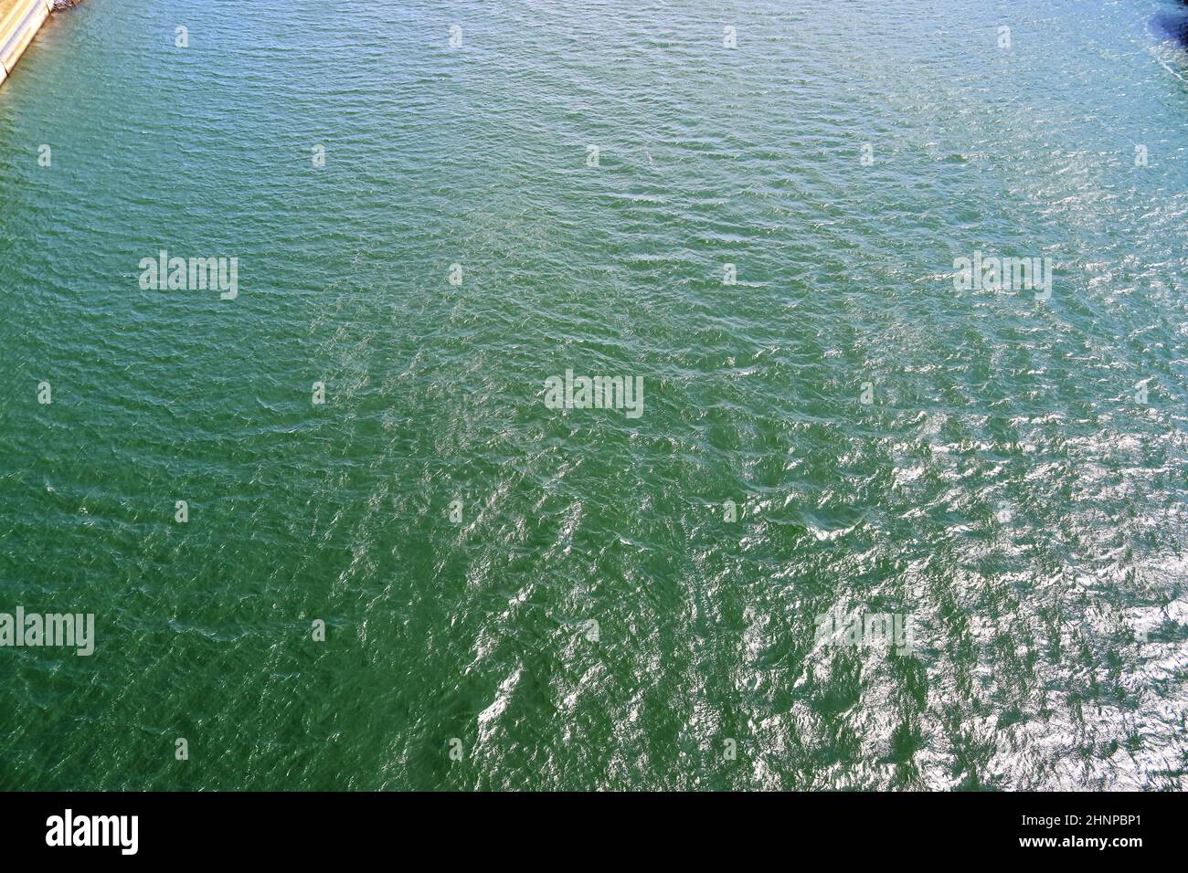 Detailed close up view on water surfaces with waves and ripples and the ...