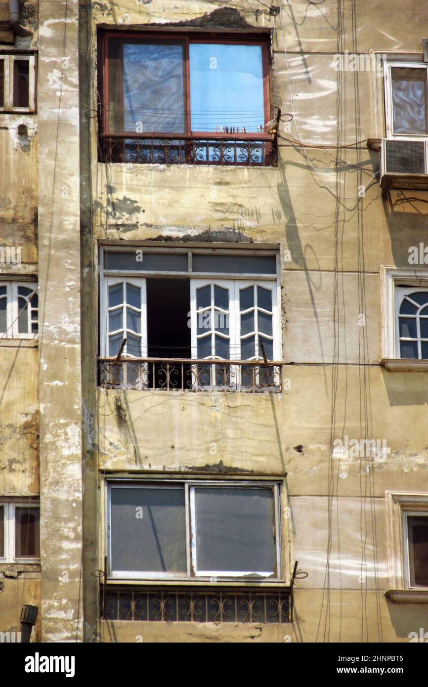 View of the wall of a high-rise building, with balconies and windows ...