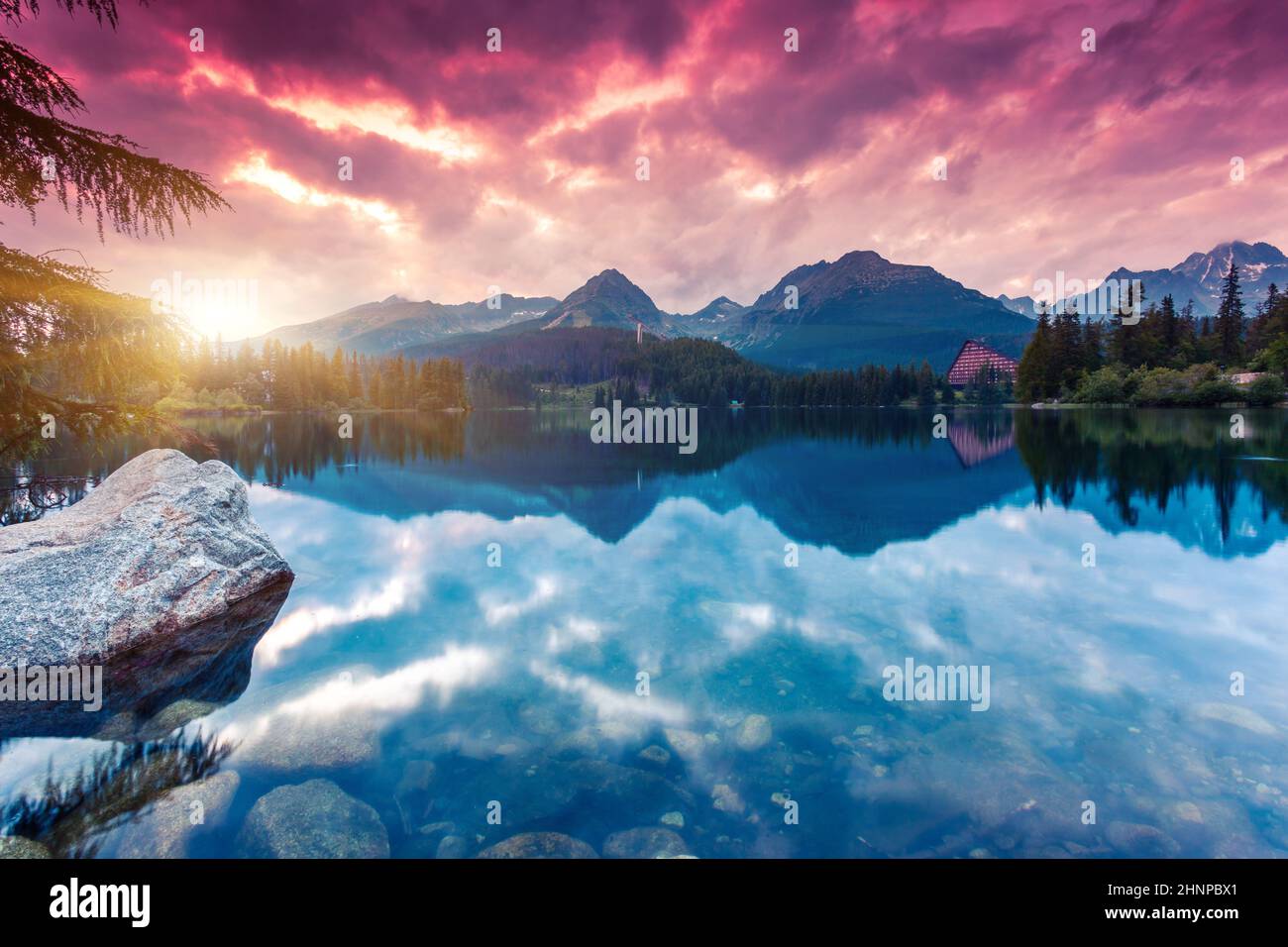 Mountain lake in National Park High Tatra. Dramatic overcast sky. Strbske pleso, Slovakia ...