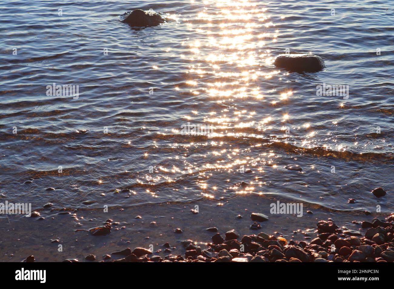 Detailed close up view on water surfaces with waves and ripples and the ...