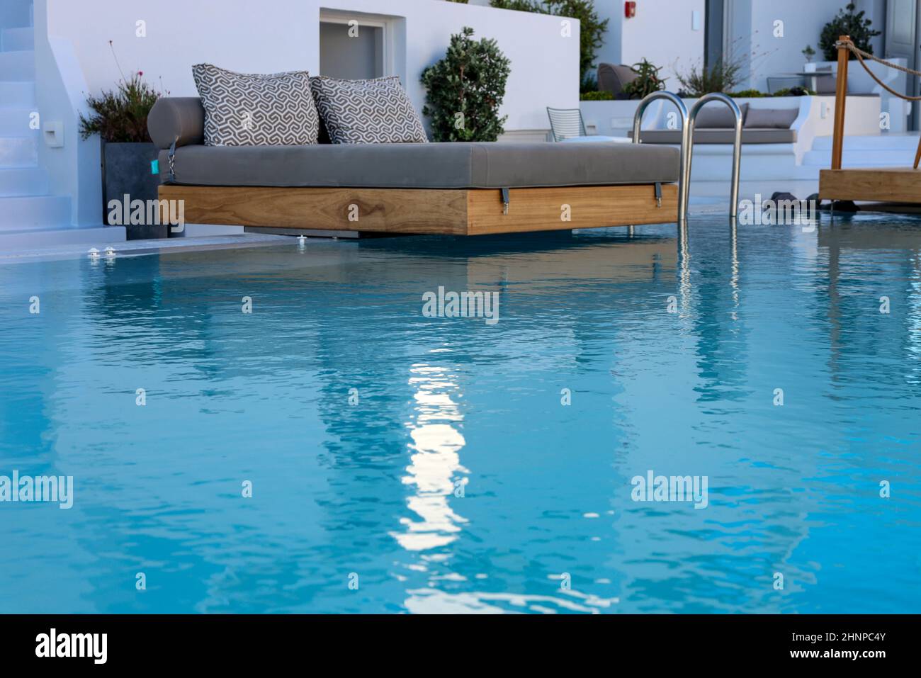 A wide bed by the pool, the perfect place for relaxing holidays Stock ...