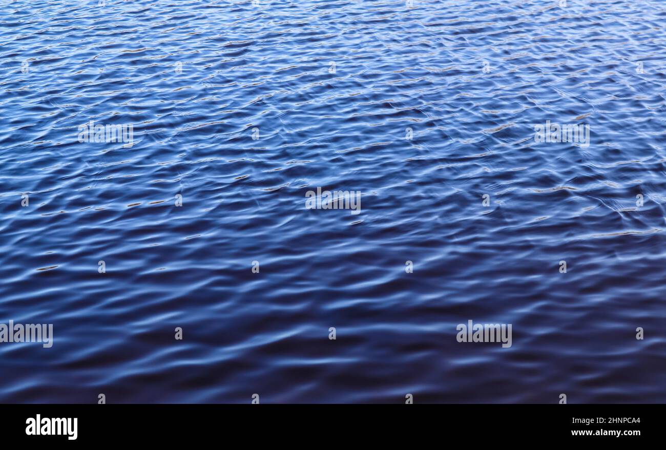 Detailed close up view on water surfaces with waves and ripples and the ... Detailed close up view on water surfaces with waves and ripples and the ...