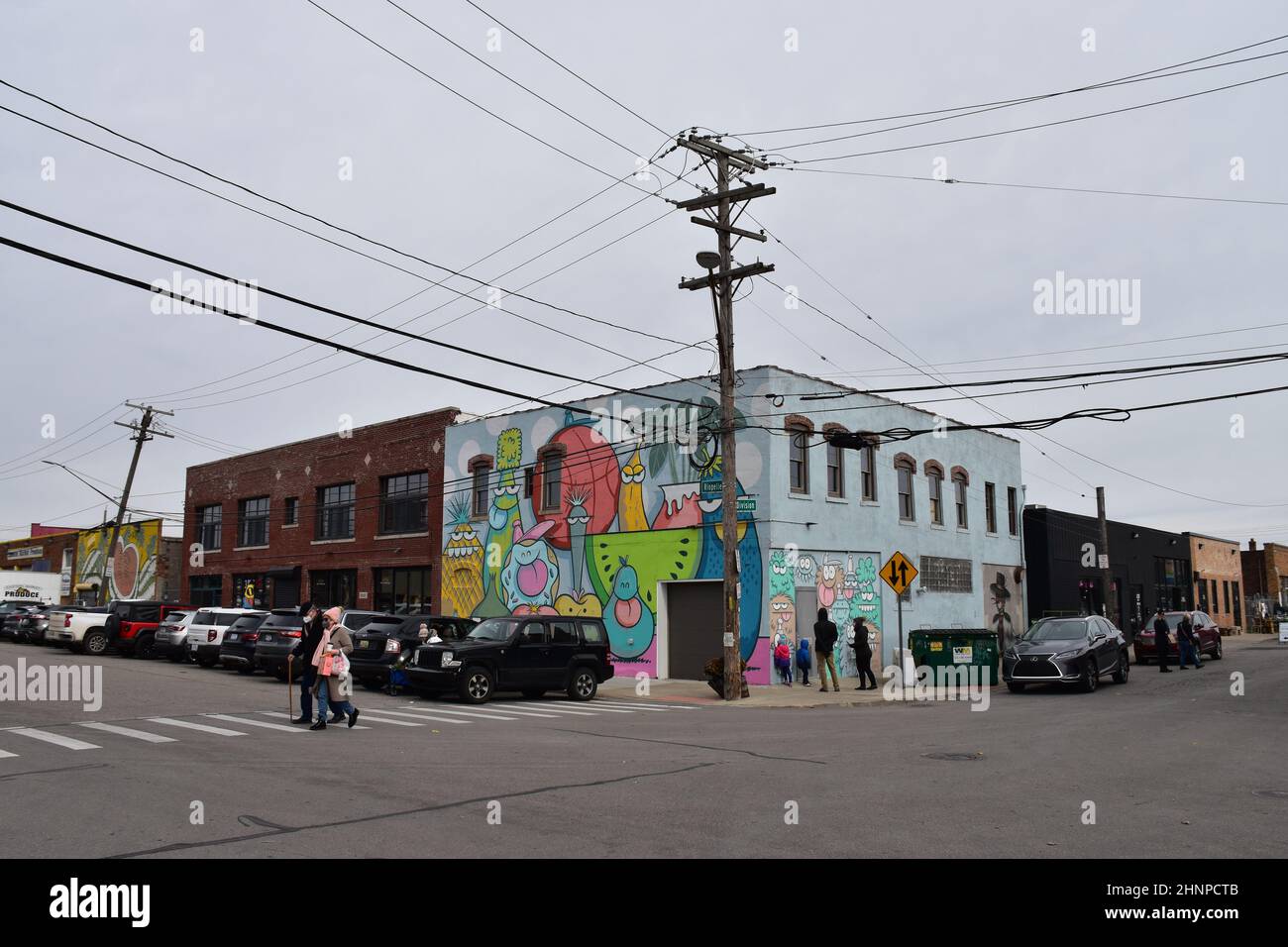 A colourful 2018 street art mural detailing animated fruit and ...