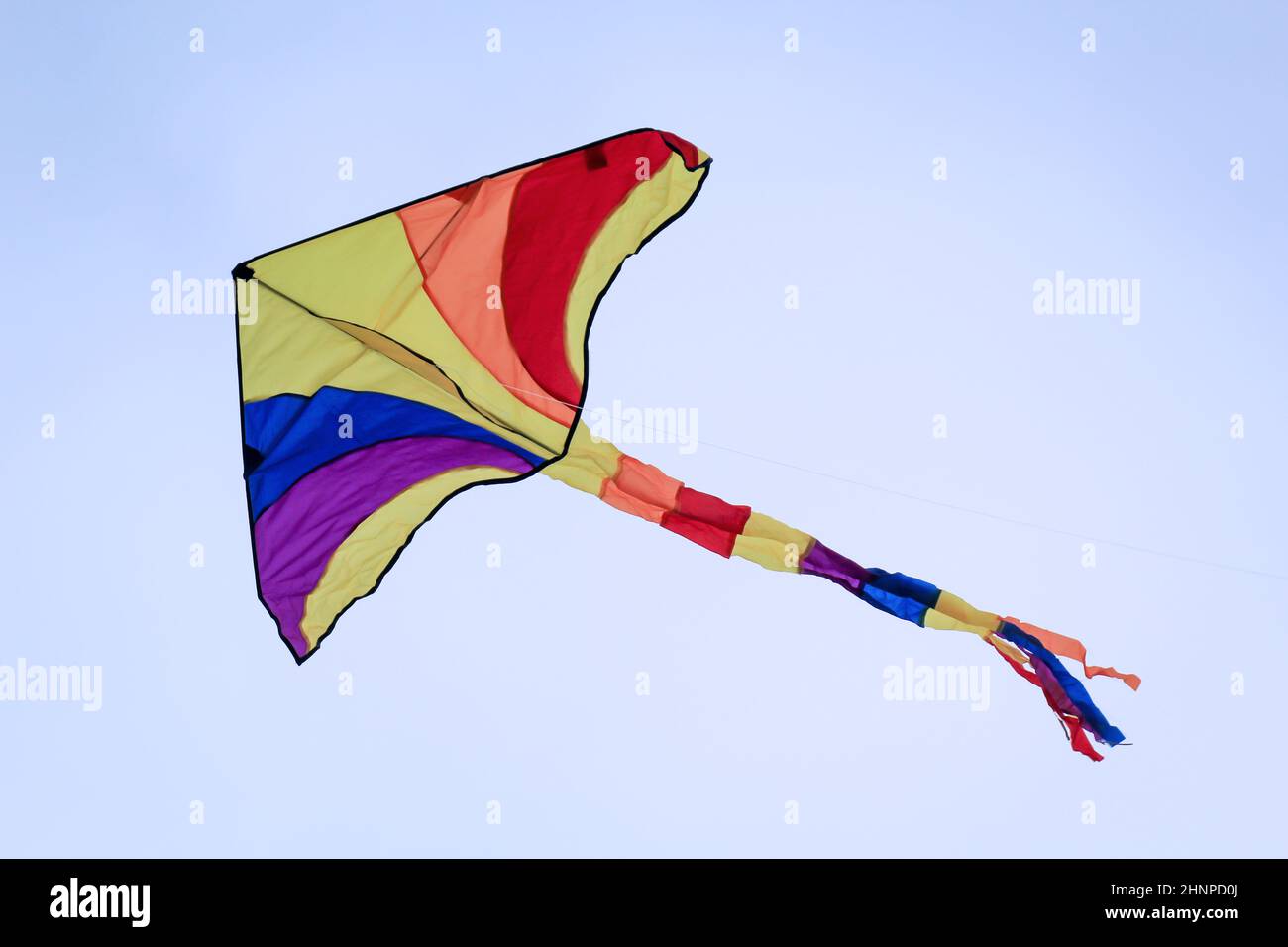 A colorful stunt kite, kite with colorful tails in the sky Stock Photo ...