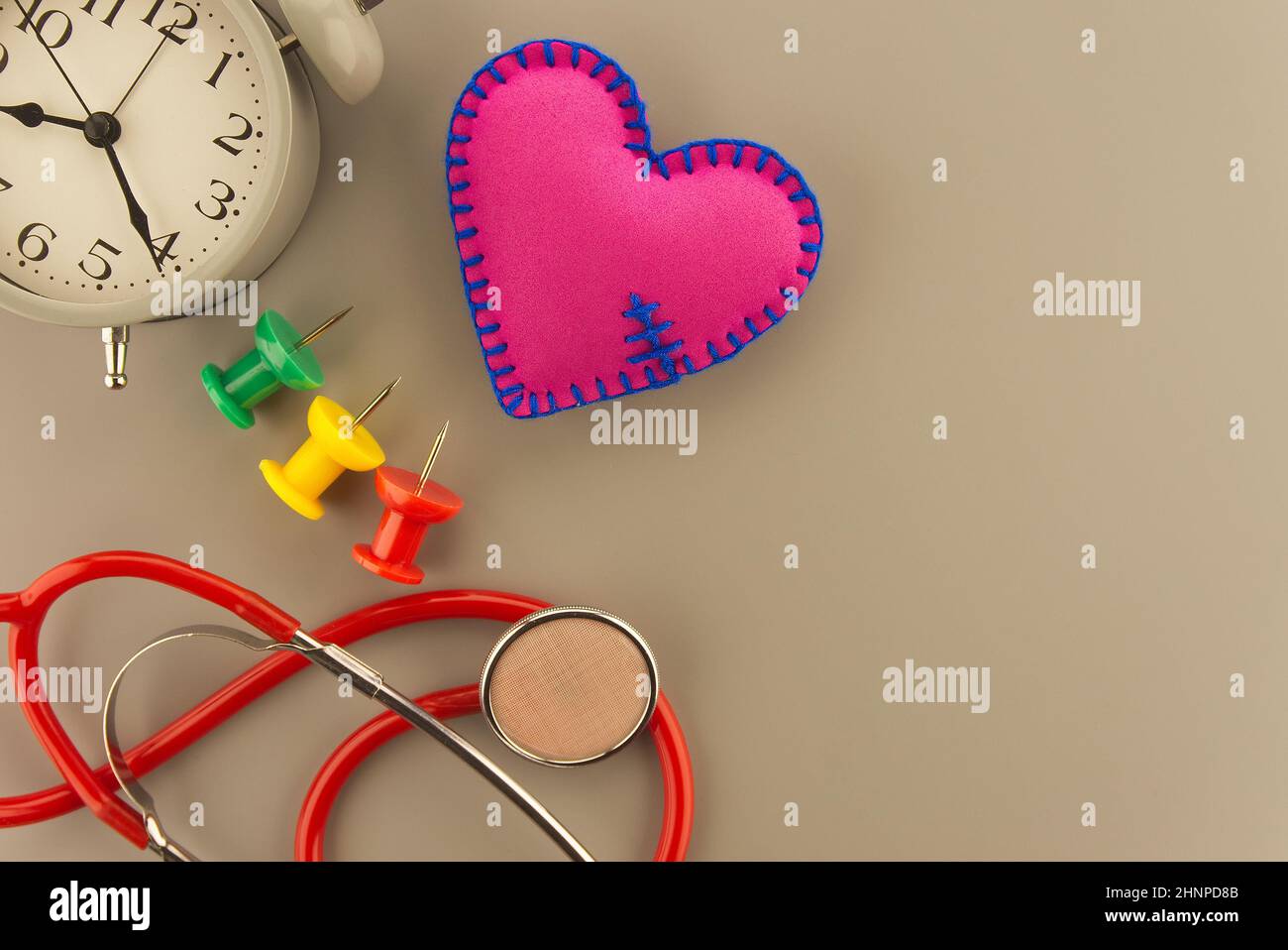 Heart pain, medical concept with multi color push pins symbolising pain ...