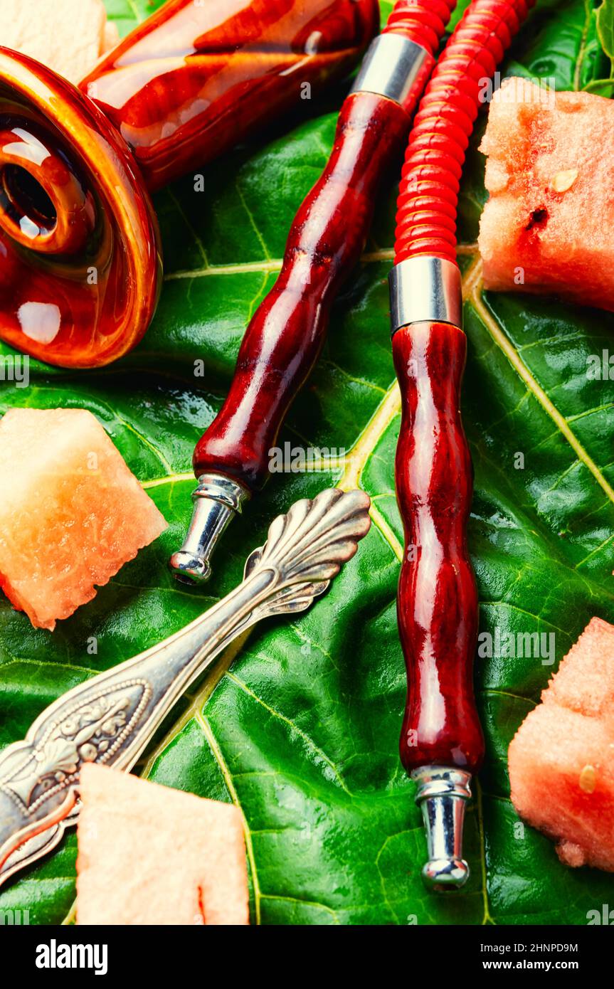 Aromatic smoking hookah with watermelon flavored tobacco Stock Photo ...