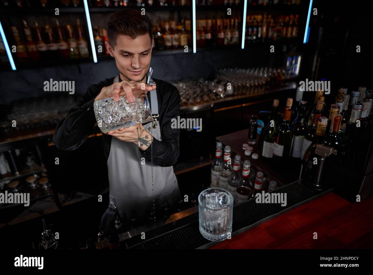 Professional male bartender makes an alcoholic cocktail Stock Photo - Alamy