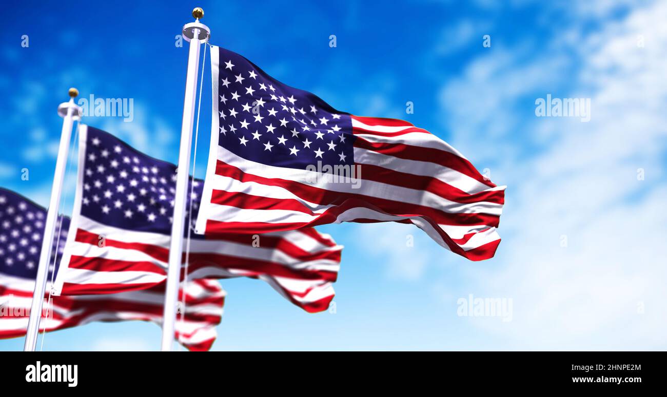 Three flags of the United States of America waving in the wind. Clear ...