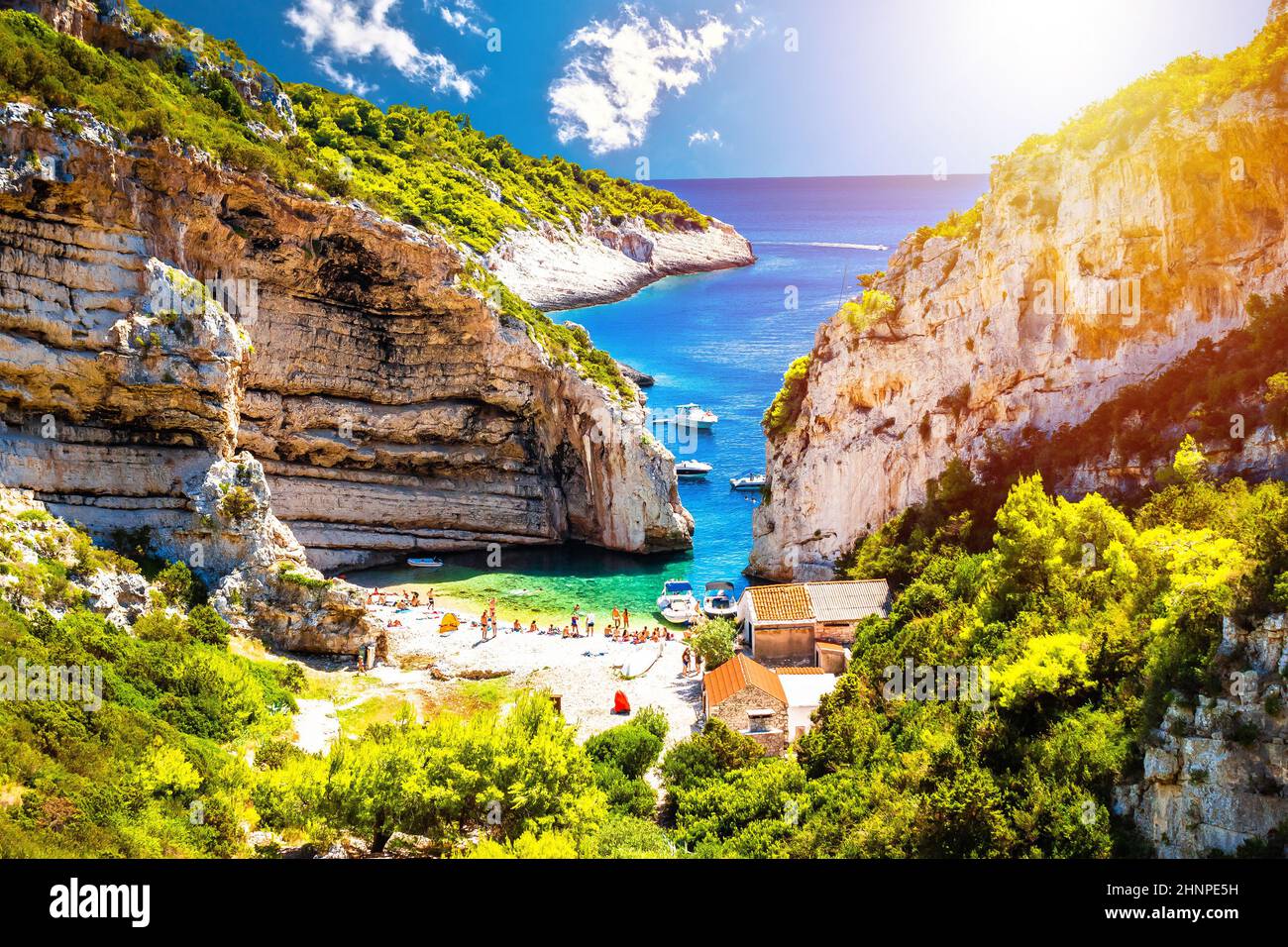 Scenic Stiniva beach on island of Vis sun haze view, Dalmatia ...
