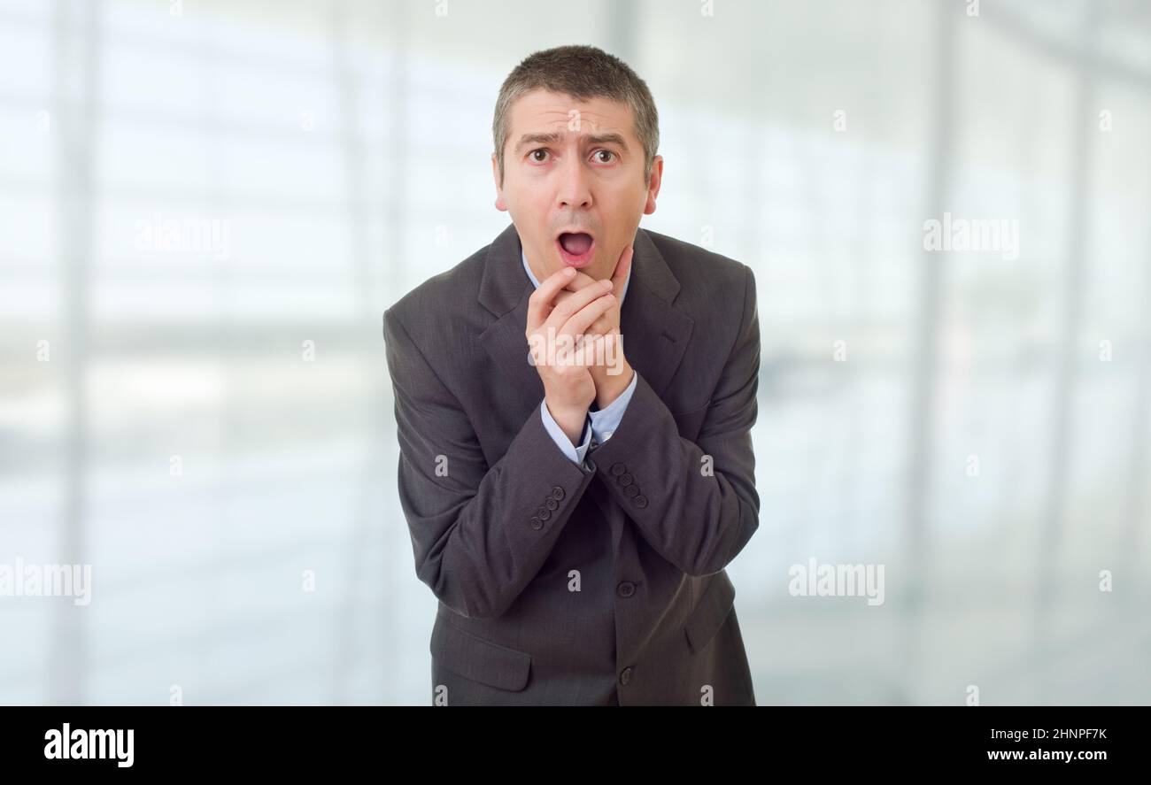 young business man surprised at the office Stock Photo - Alamy