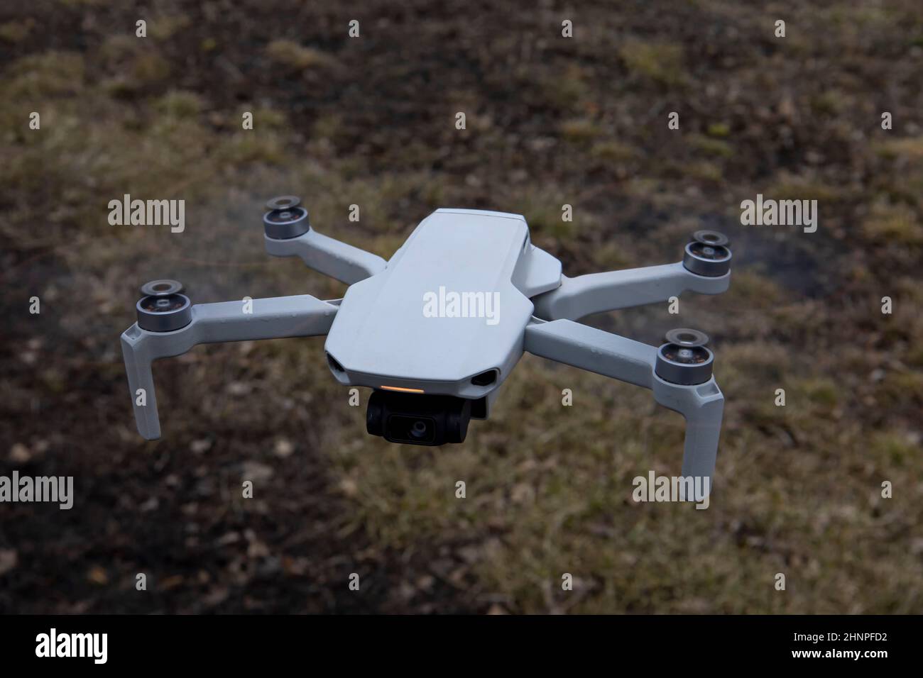 Gray quadcopter, drone in flight Stock Photo - Alamy
