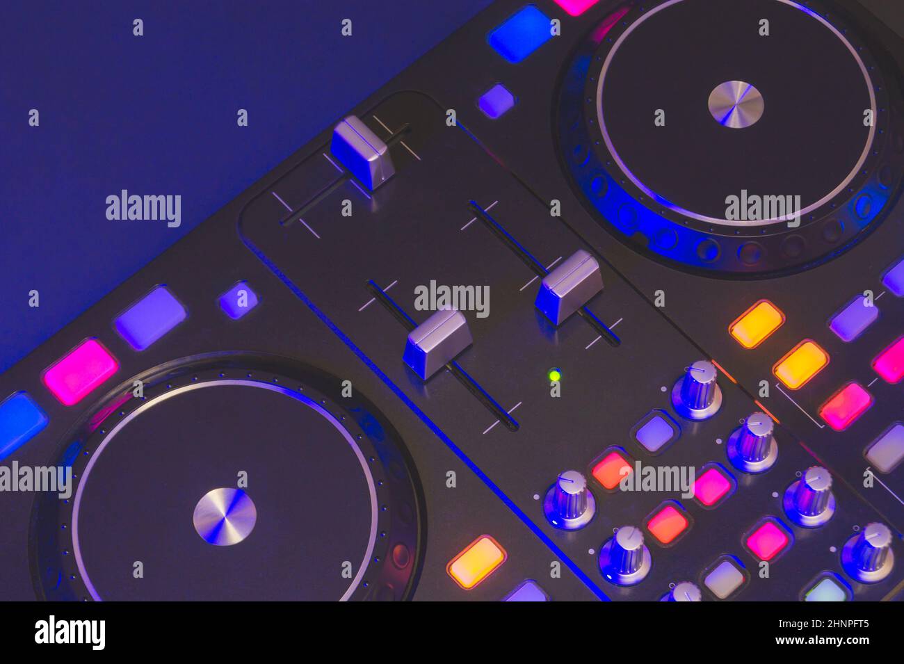 Dj sound mixer controller with knobs and sliders close up. audio mixing ...