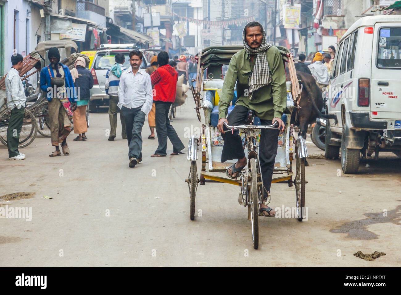 indian rickshaw driver looks for passengers in the old part of New ...