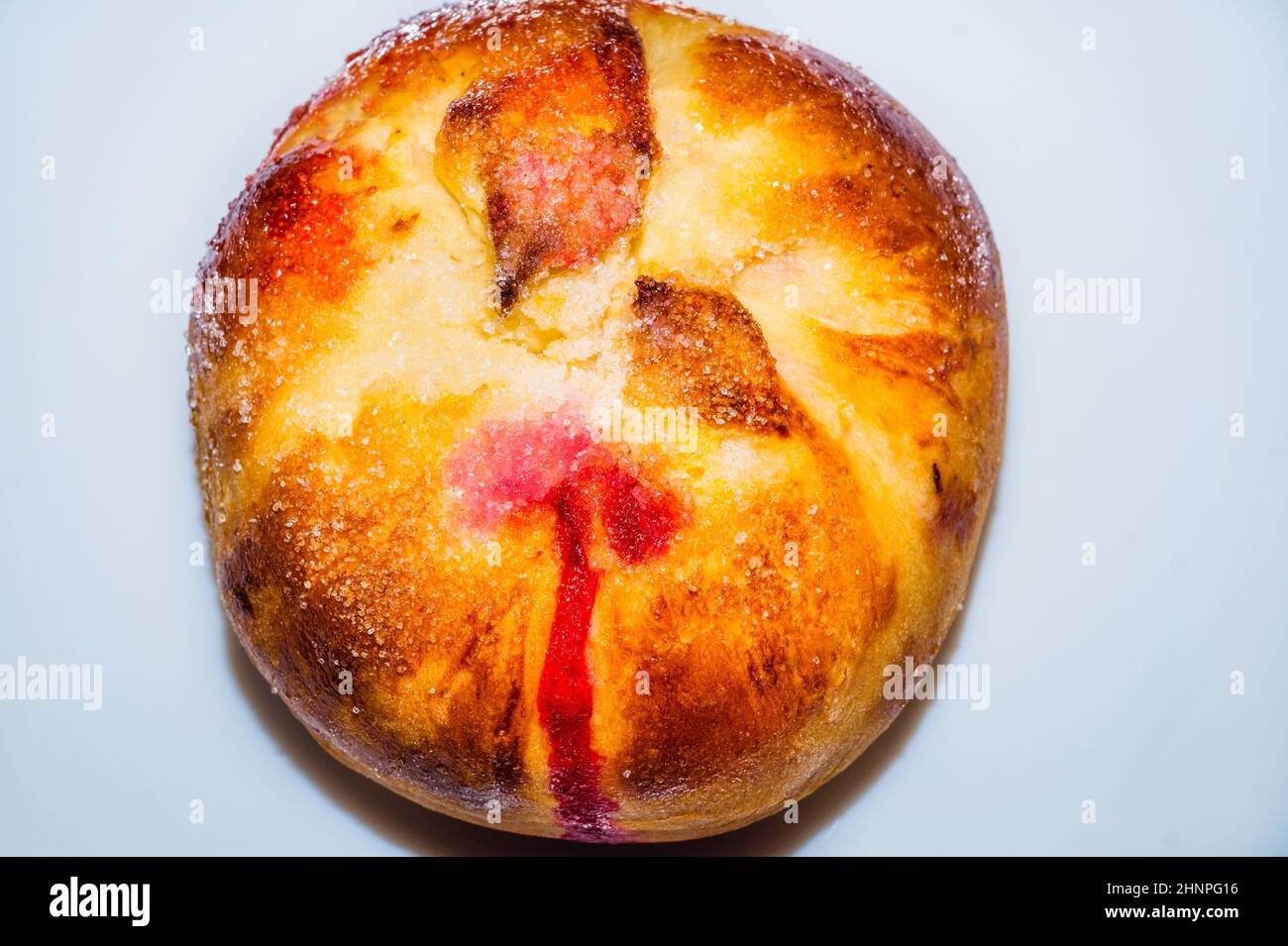 Bun with red sweet jam inside. sweet baking close up Stock Photo - Alamy