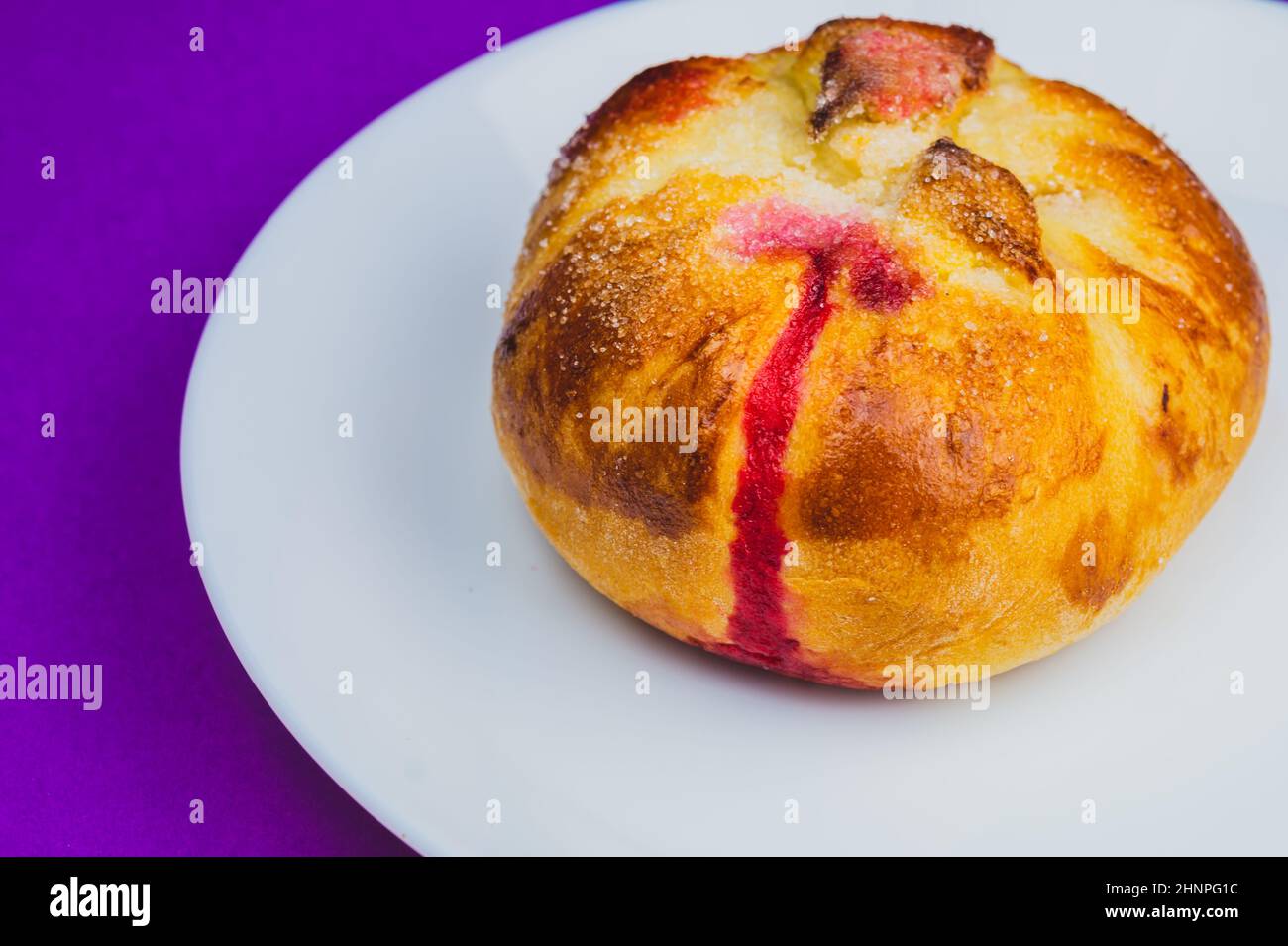 Bun with red sweet jam inside. sweet baking close up Stock Photo - Alamy