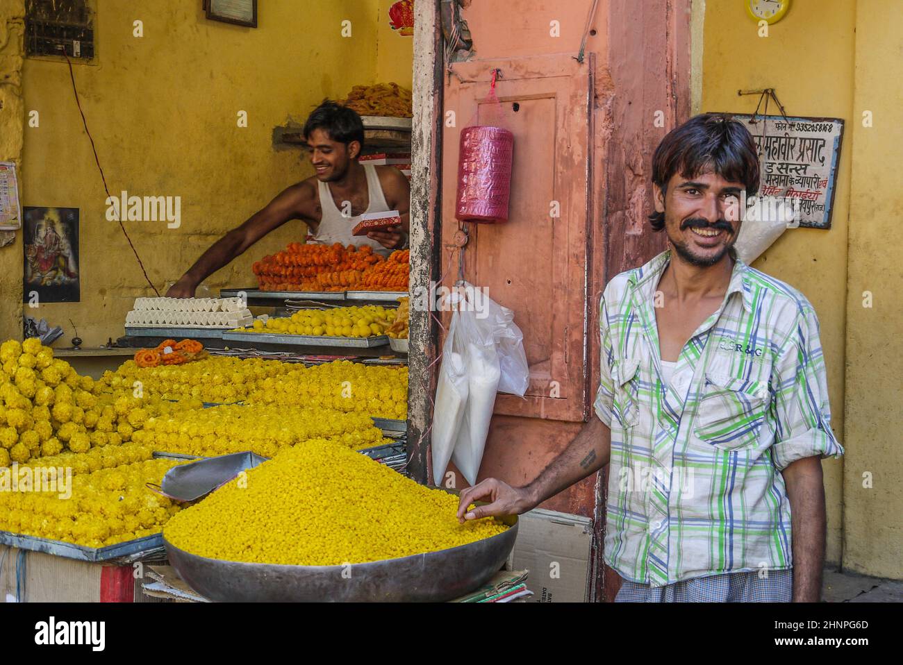 people in the food mile in Agra sell riceballs and rice with curry and ...