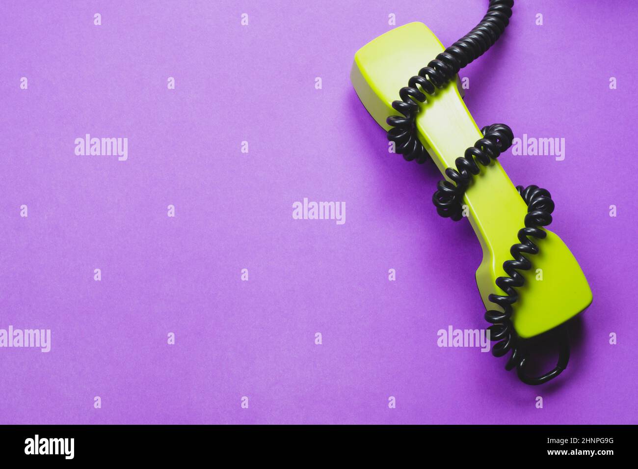 Vintage green telephone handset. phone receiver isolated on purple ...