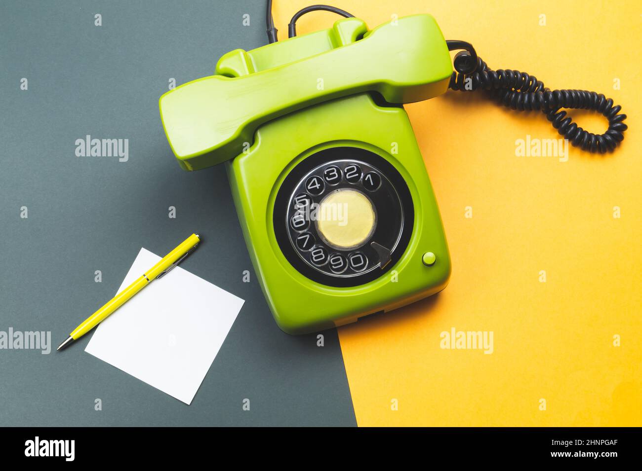 Classic phone with handset. pen with a note. office background. vintage ...
