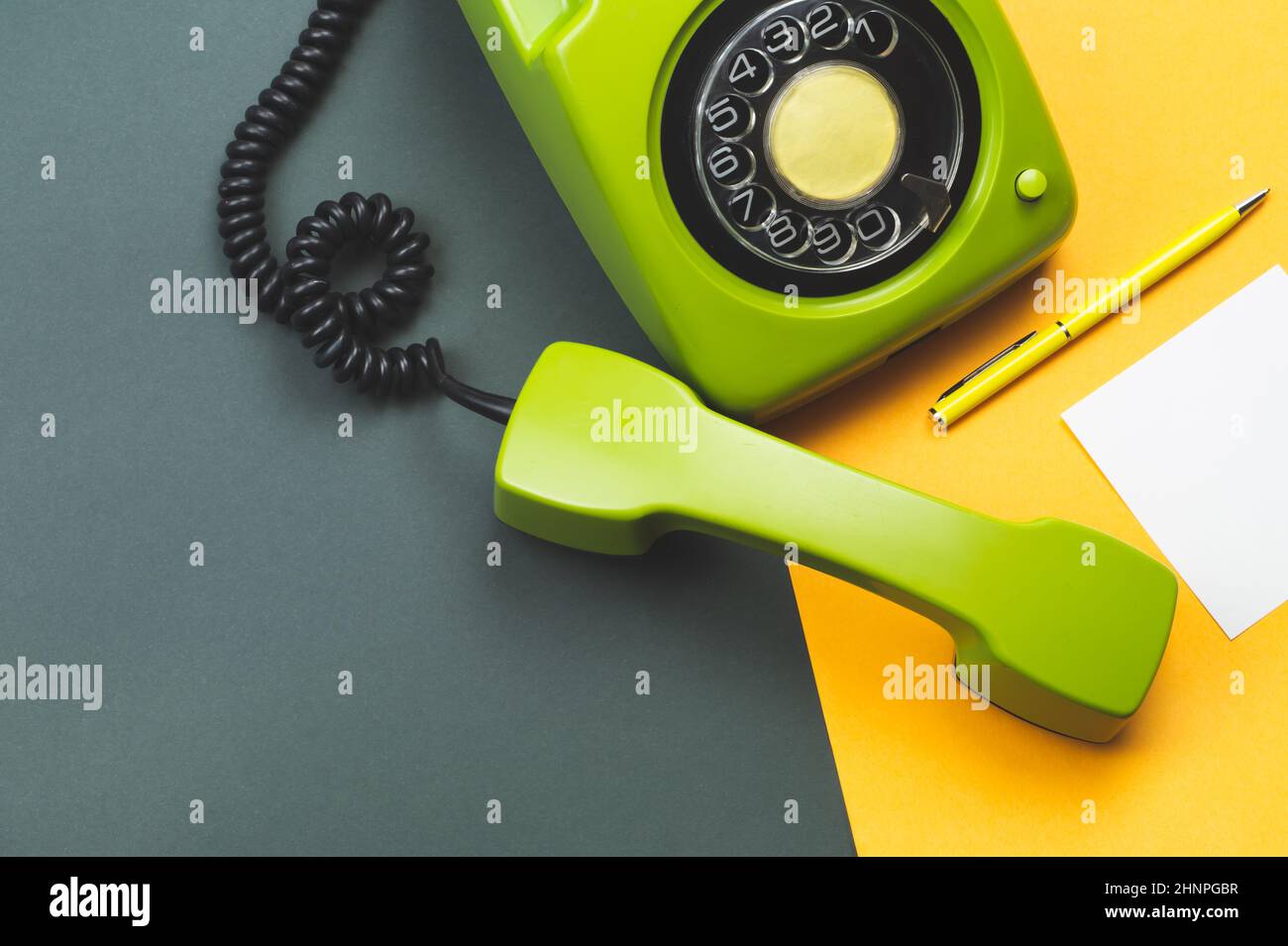 Classic phone with handset. pen with a note. office background. vintage ...