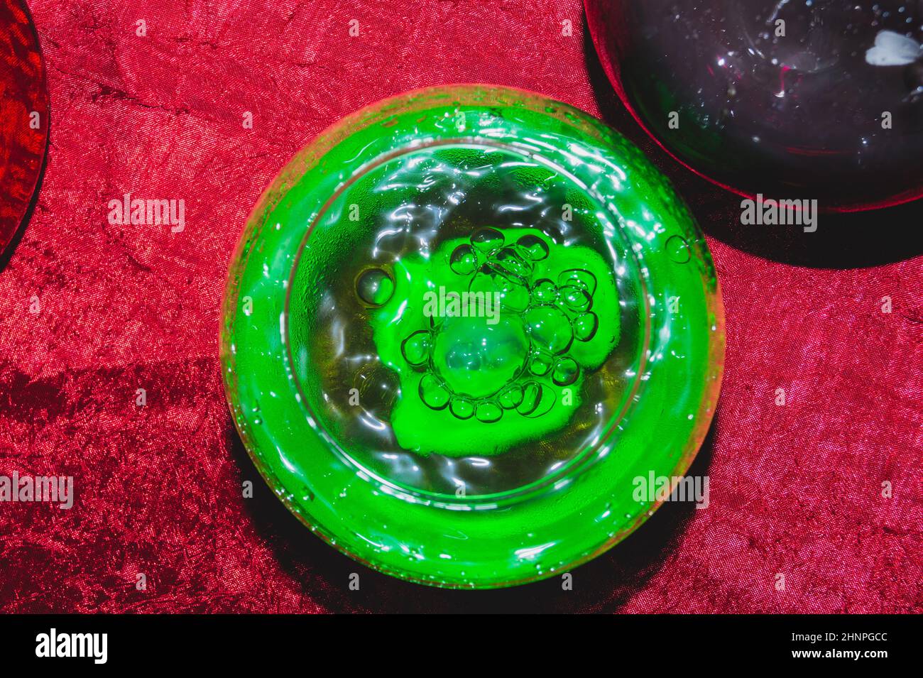 Green liquid boils in a glass flask. laboratory equipment Stock Photo ...
