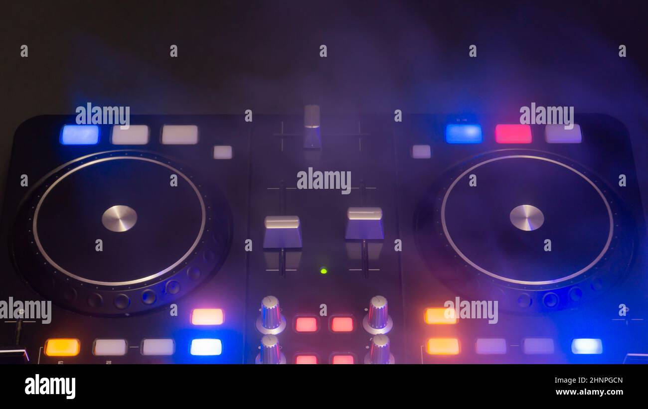 Dj sound mixer controller with knobs and sliders close up. audio mixing ...